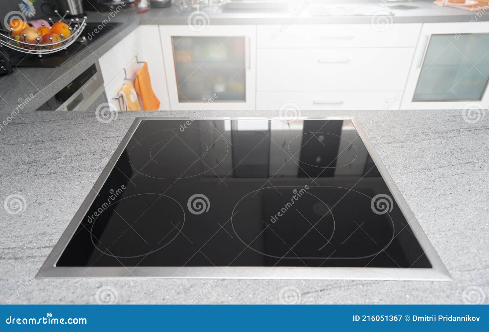 Built-in Induction Cooker with a Black Glass Surface in the Kitchen ...