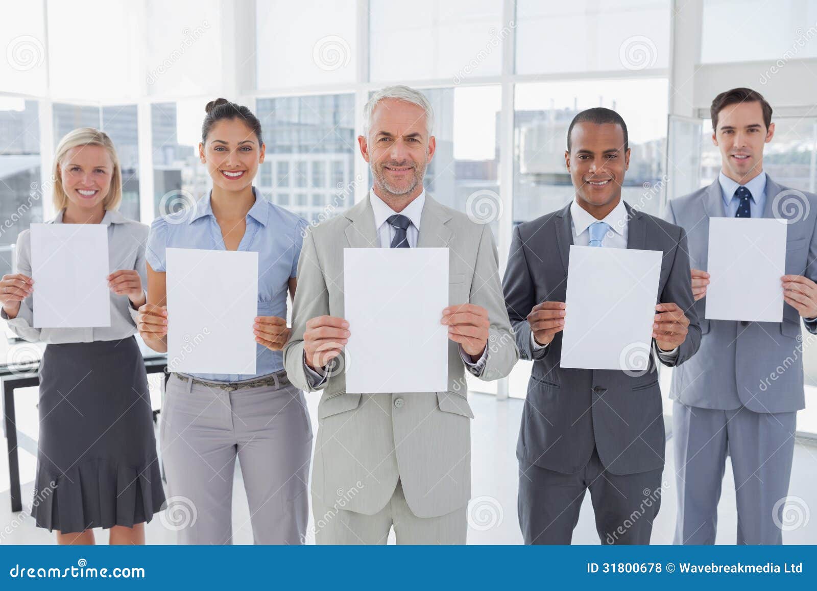 Buisness Team Holding Up Blank Pages Stock Photo - Image of business ...