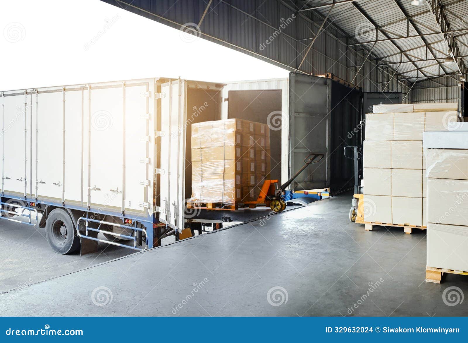 Bulk Pallets of Packaging Boxes Being Loaded Onto a Container Truck ...