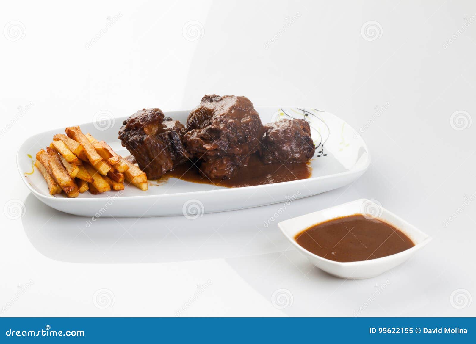 Bull Tail Dish with Fried Potatoes on White Table Stock Image - Image ...