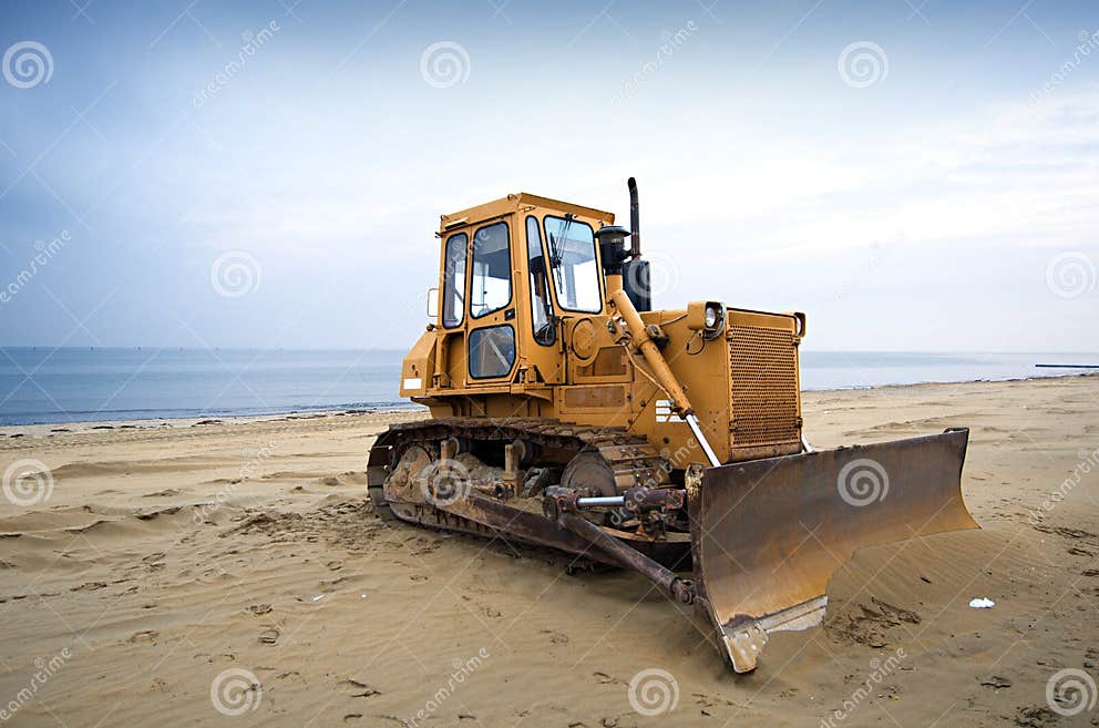 Bulldozer on the beach stock photo. Image of machine - 24528136