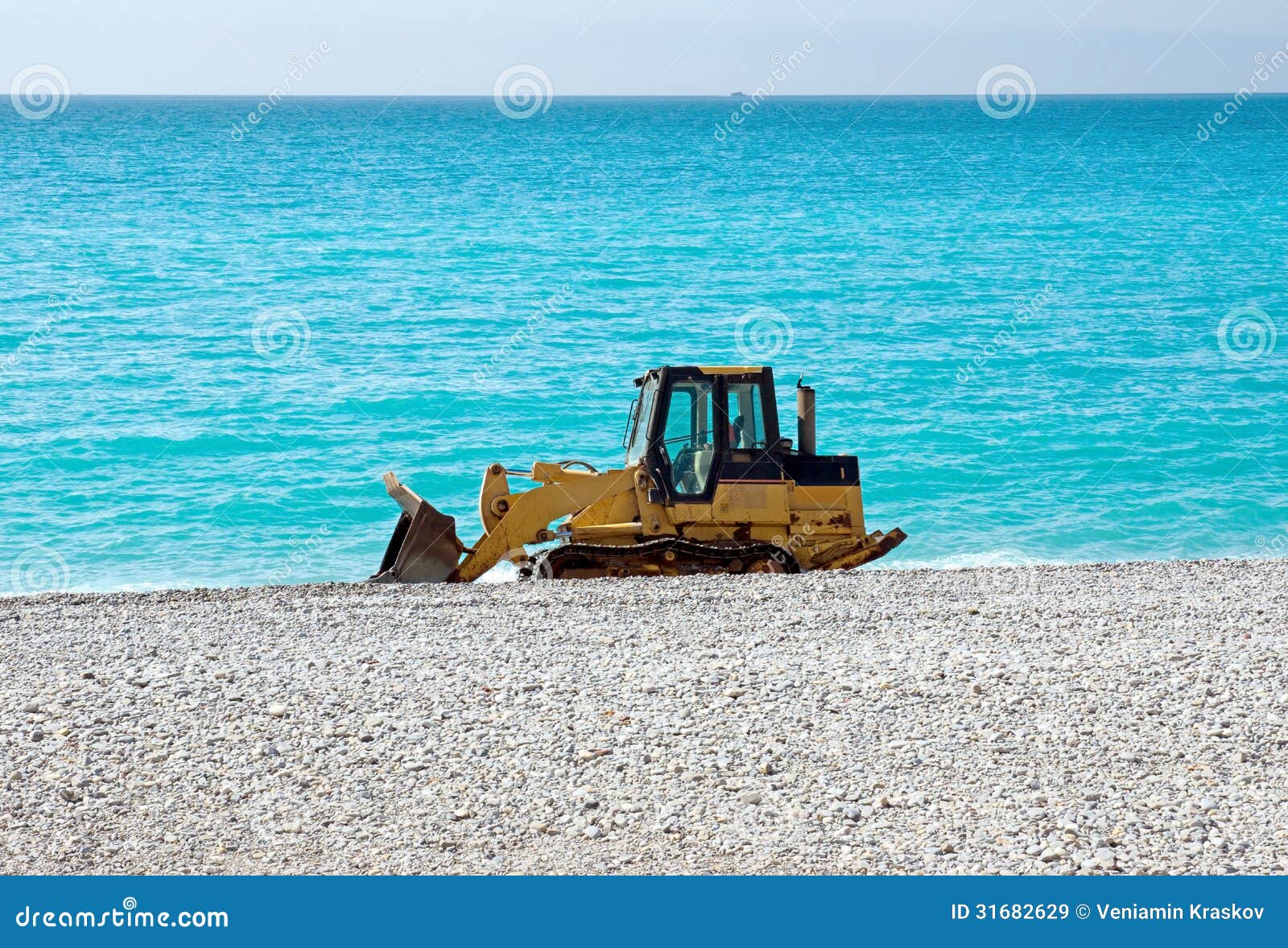 Bulldozer on the beach stock image. Image of france, equipment - 31682629