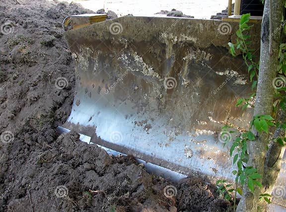 Bulldozer blade close-up stock image. Image of deforestation - 135348397