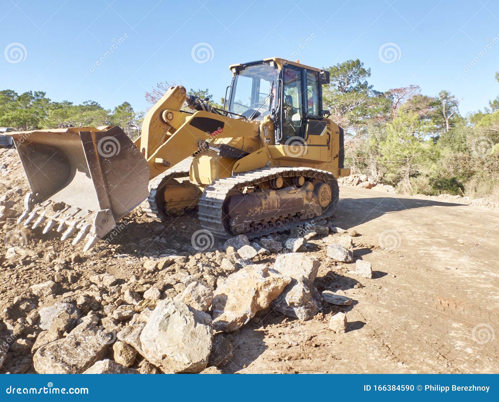 Bulldozer is Moving Boulders during Road Construction Works Stock Photo ...