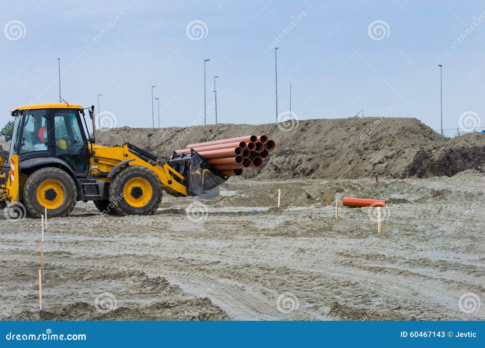 Bulldozer carring pipes stock image. Image of equipment - 60467143