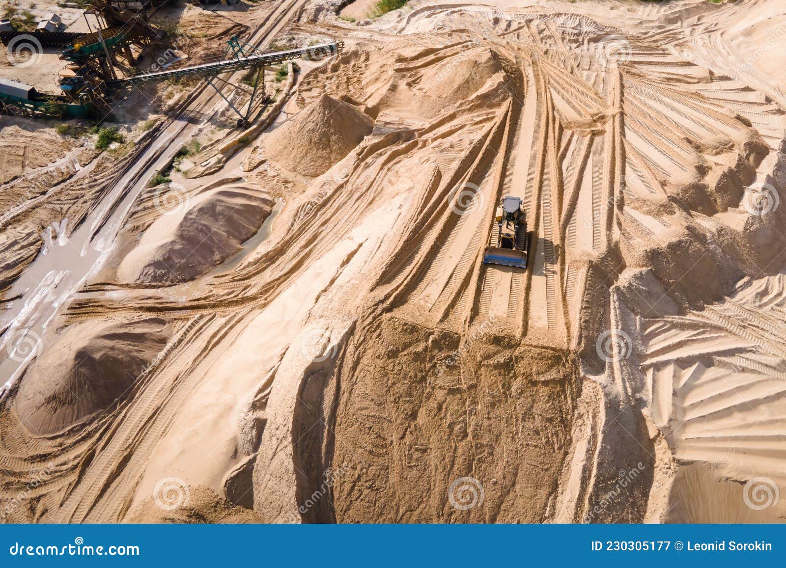 Bulldozer Digging Sand in a Sandy Quarry. Sand Quarry in Working ...