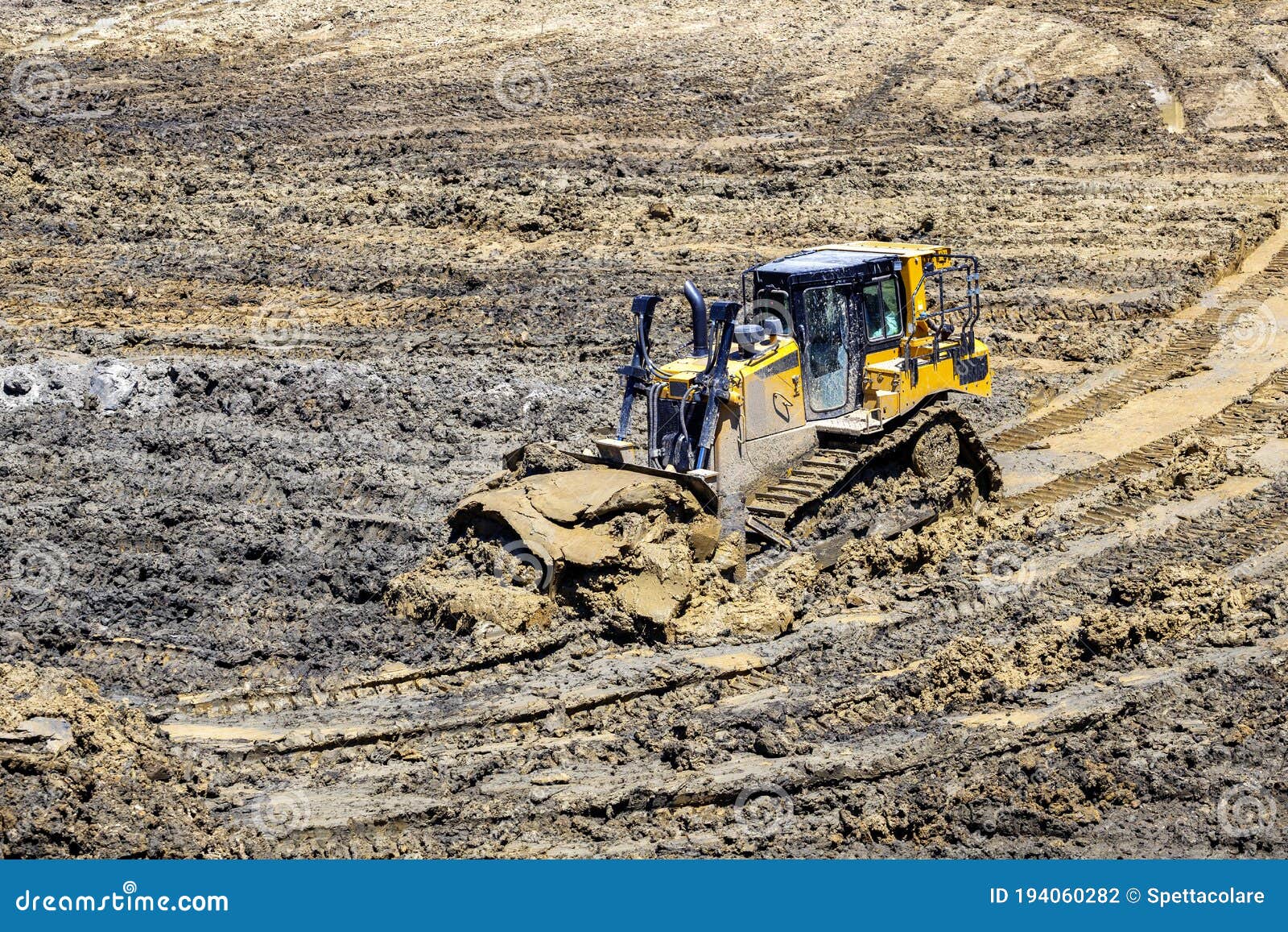 Bulldozer in Excavation Pit Leveling the Ground Stock Photo - Image of ...