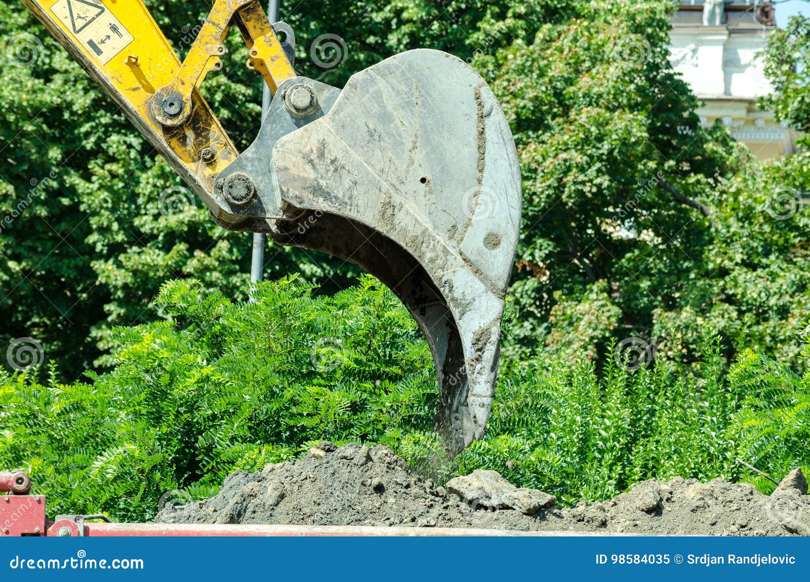 Bulldozer Excavator Loading Ground To Dumper Truck on the Construction ...
