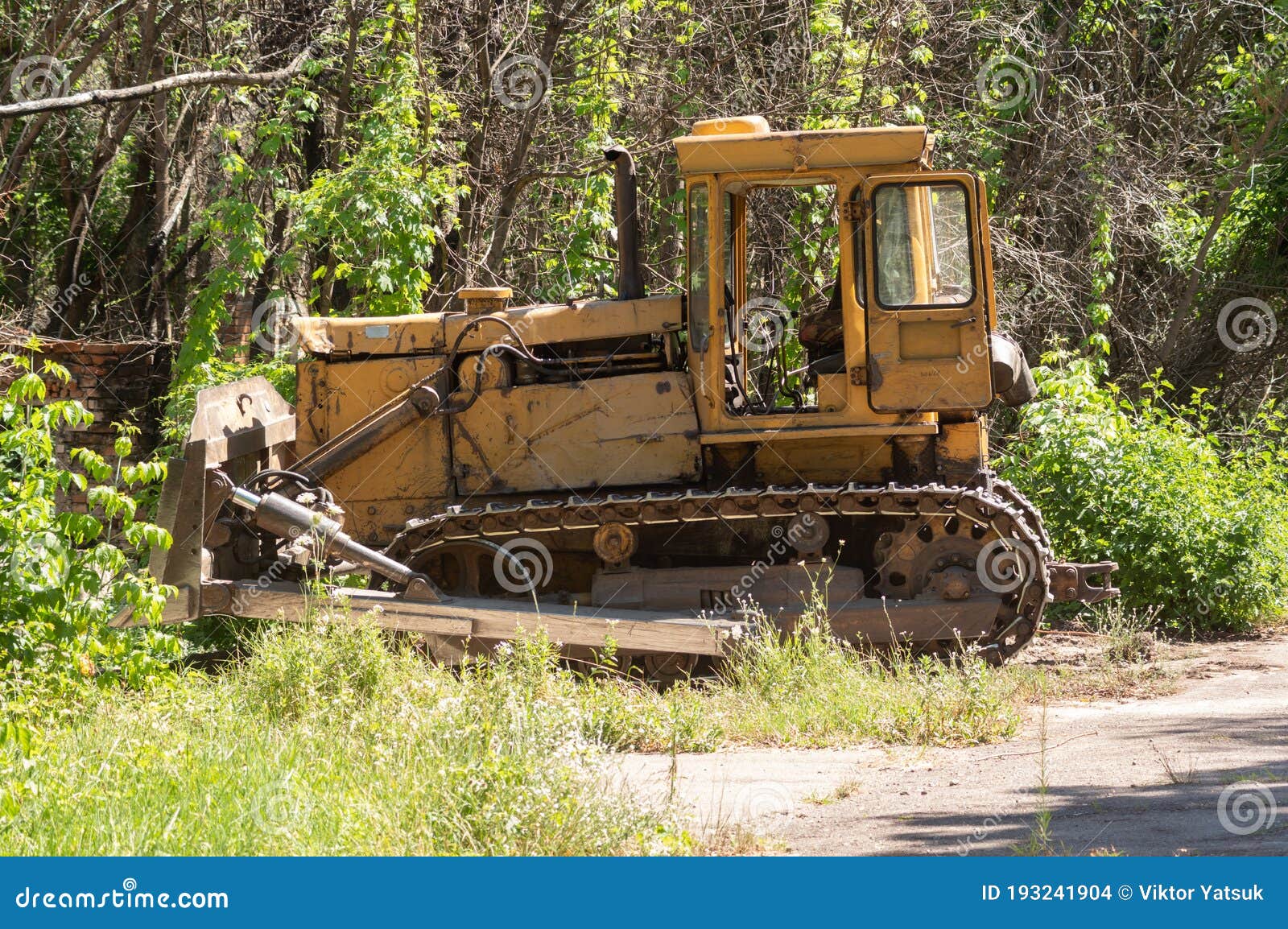 Bulldozer in the Forest. Large Tractor with a Bucket Stock Photo ...
