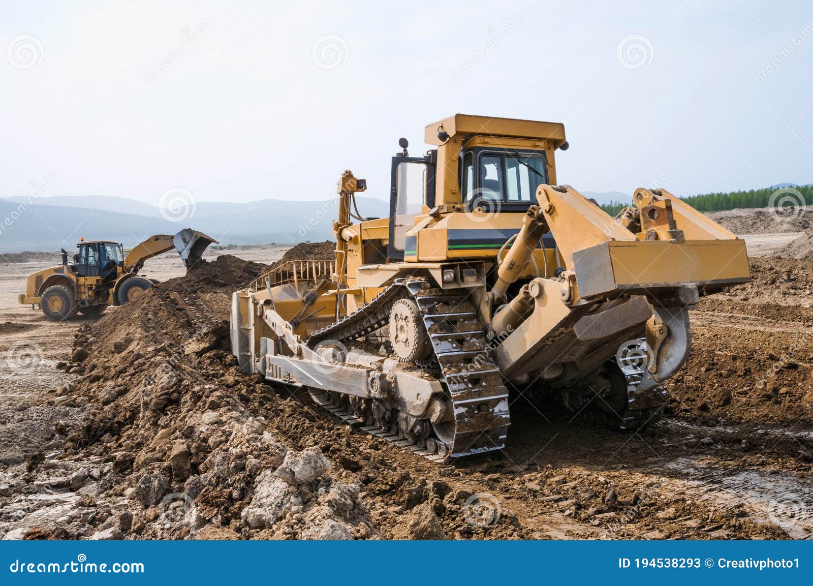 Bulldozer and Front Loader Rake the Ground Stock Image - Image of ...