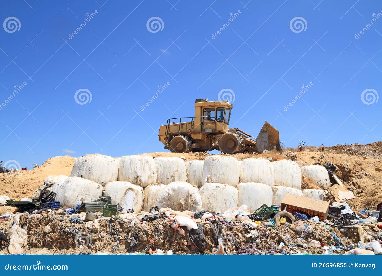 Bulldozer At Landfill For Work Concrete Demolition Waste. Salvaging And ...
