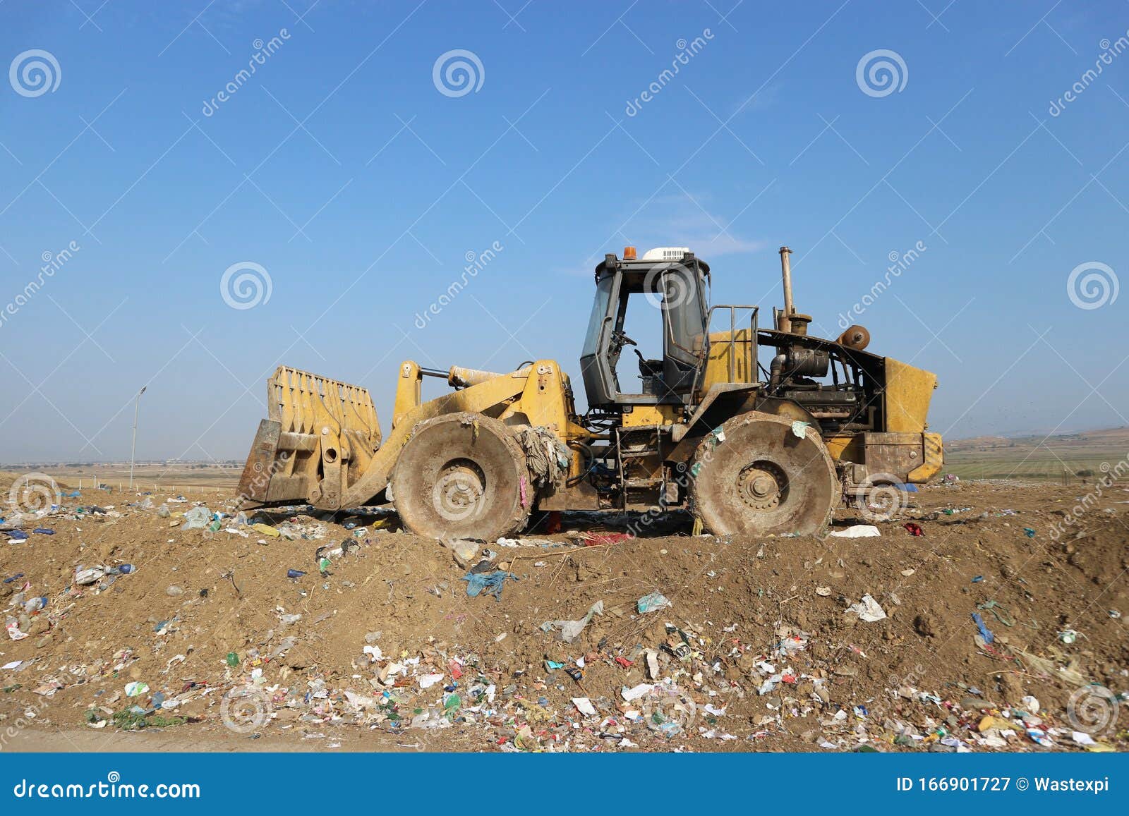 Bulldozer Landfill Compactor in a Sanitary Landfill Stock Image - Image ...