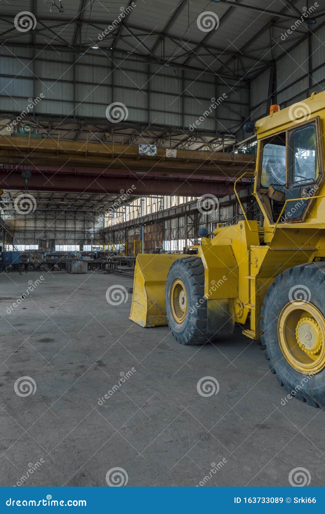 Bulldozer in a Large Industrial Building Stock Image - Image of ...