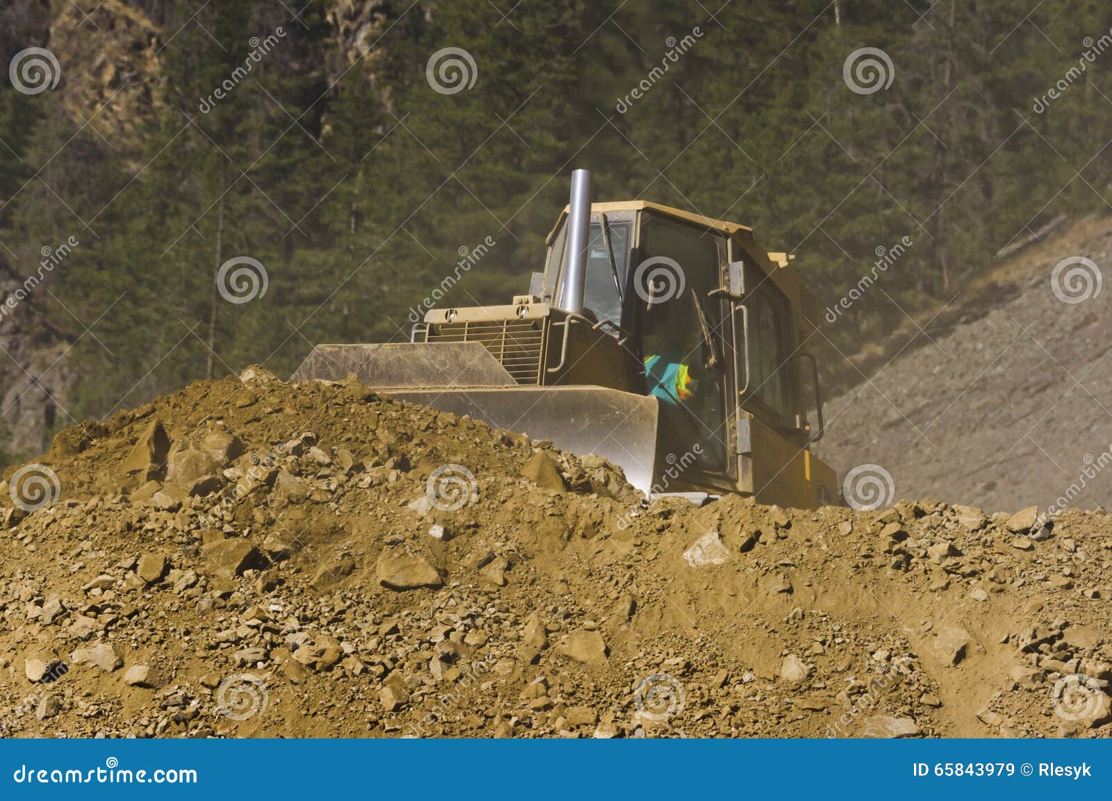Bulldozer leveling dirt stock image. Image of building - 65843979