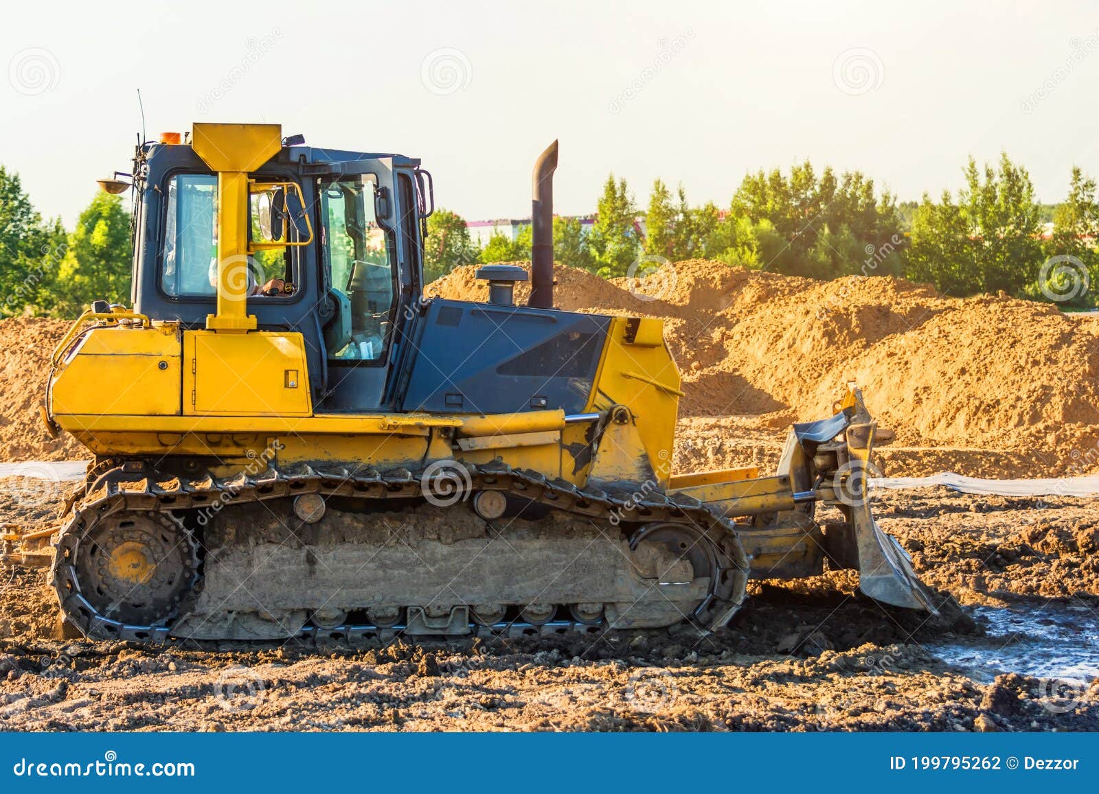 The Bulldozer Levels the Ground during the Construction of Engineering ...