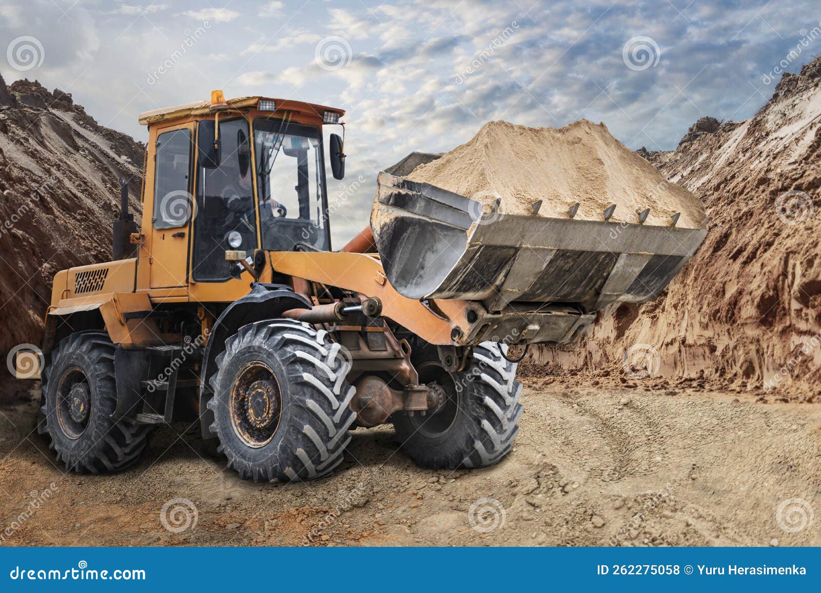 Bulldozer or Loader Moving Sand on a Construction Site in a Pit. an ...