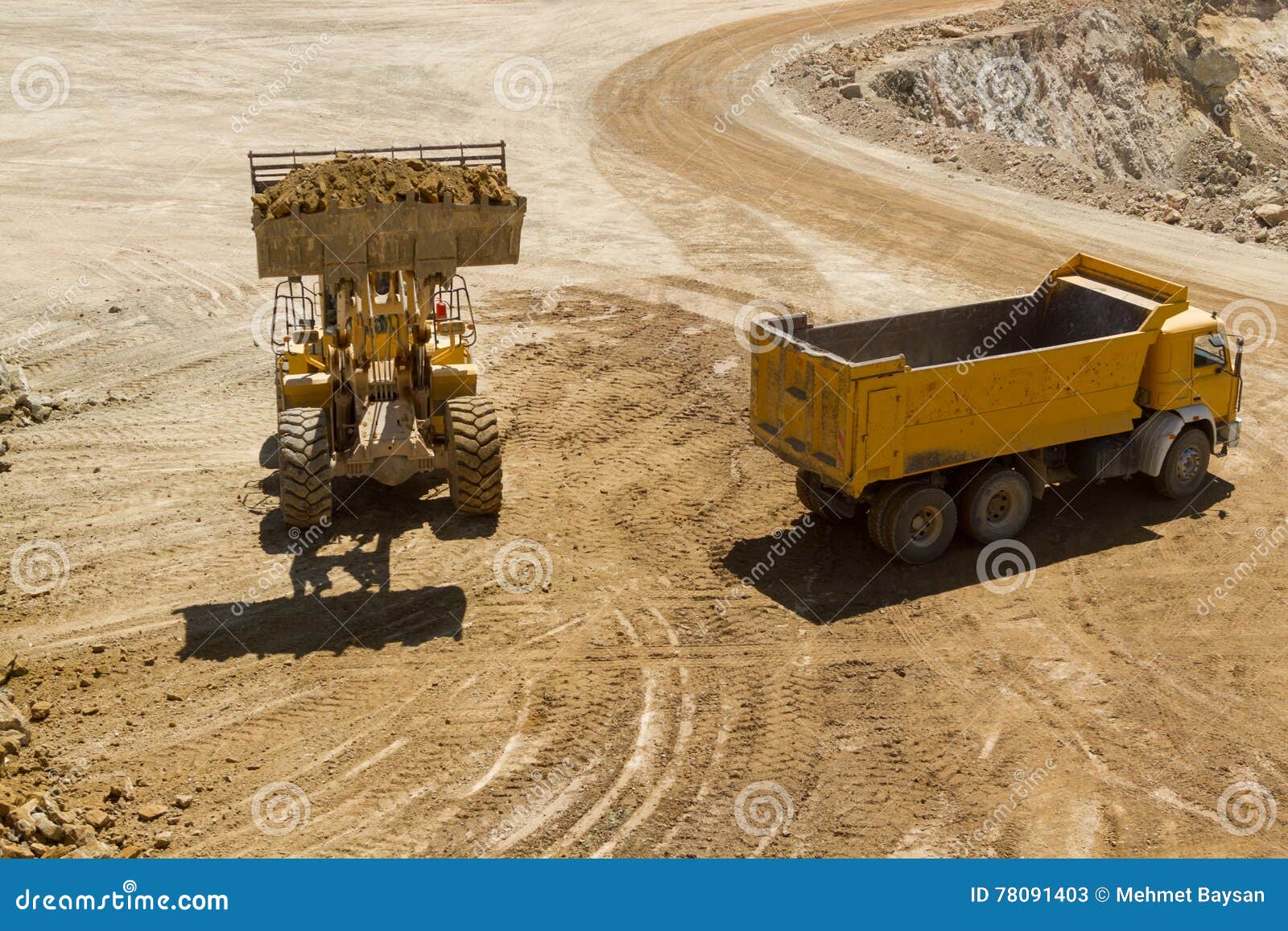 Bulldozer loading truck stock image. Image of architecture - 78091403