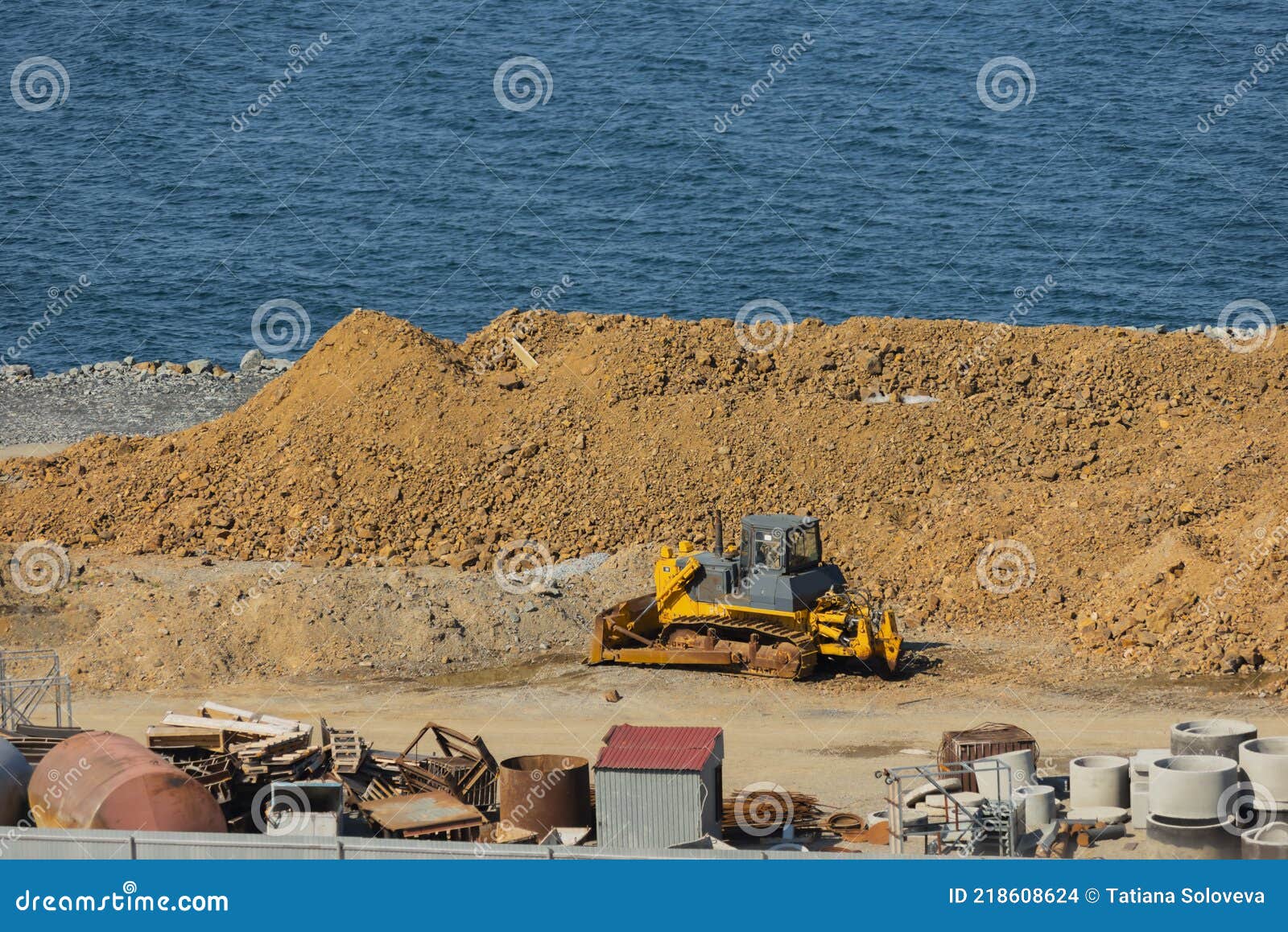 The Bulldozer Moves and Spreads the Soil and Rubble. Work Bulldozer a ...