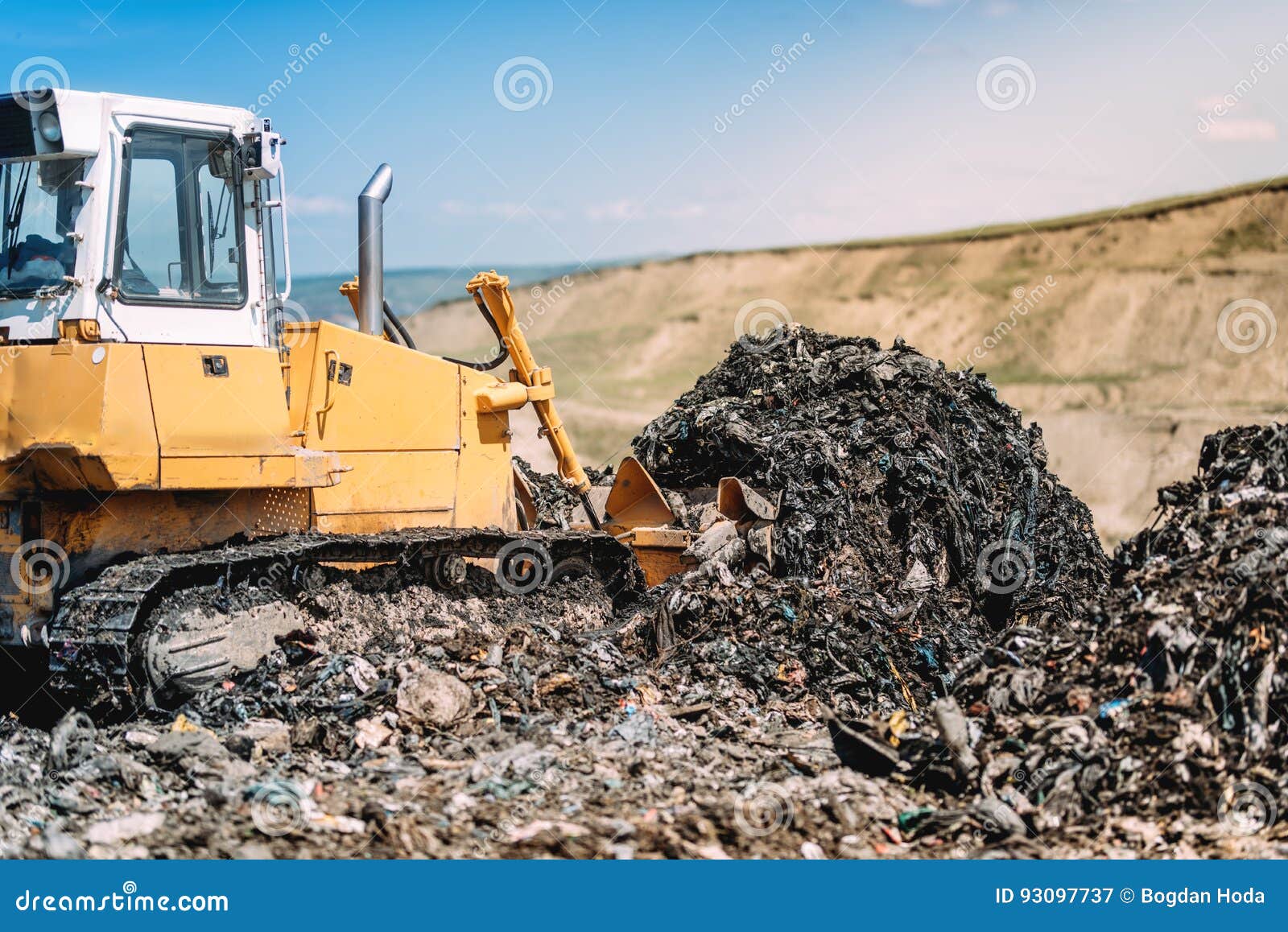Details Of Garbage Dump. Heavy Duty Excavator Digging And Loading Urban ...