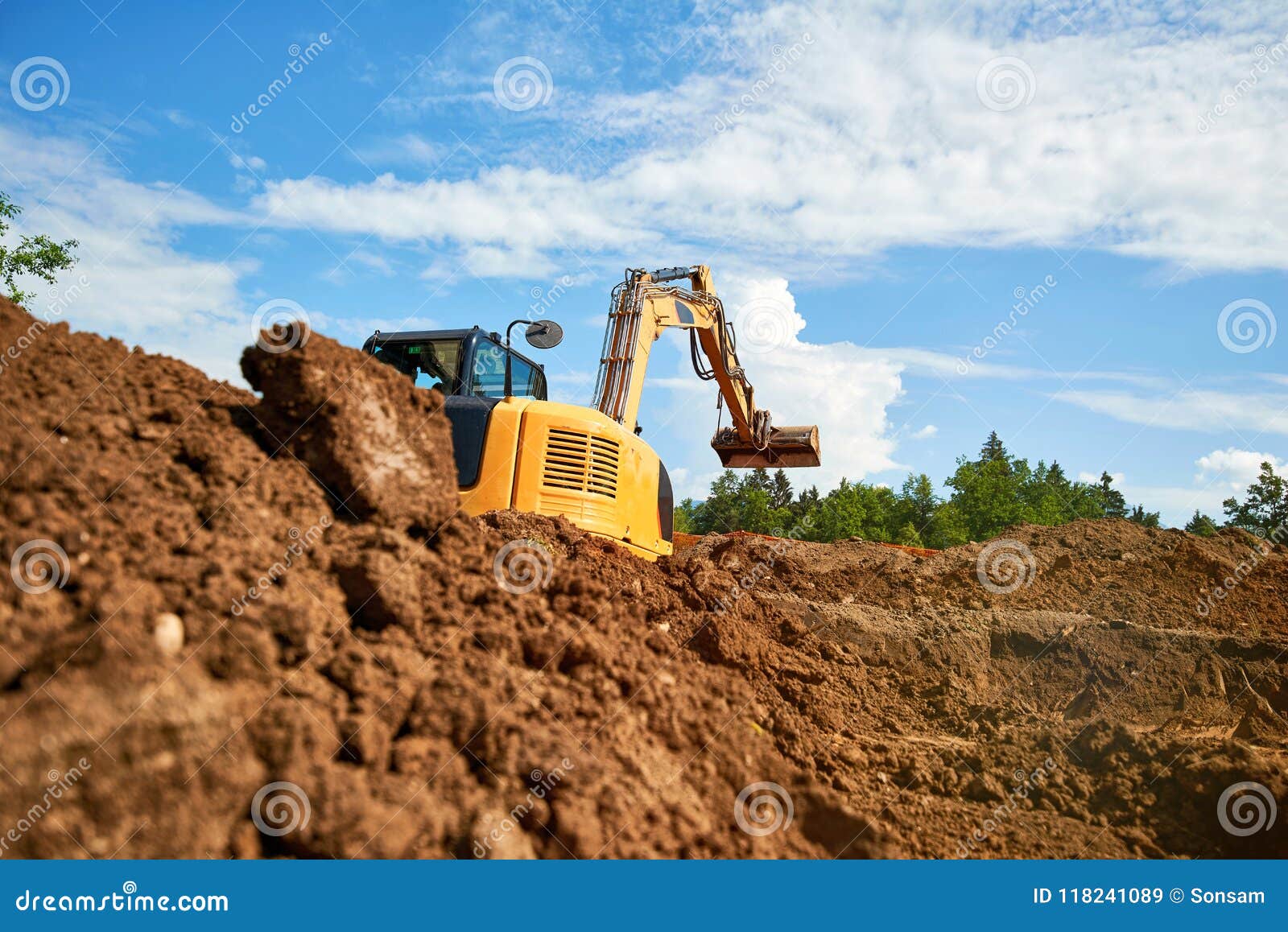 Excavator at Construction Site - Digging Foundations for House Stock ...
