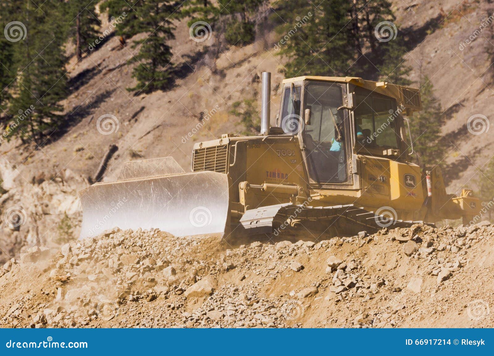 Bulldozer and Operator Leveling Dirt Editorial Stock Image - Image of ...