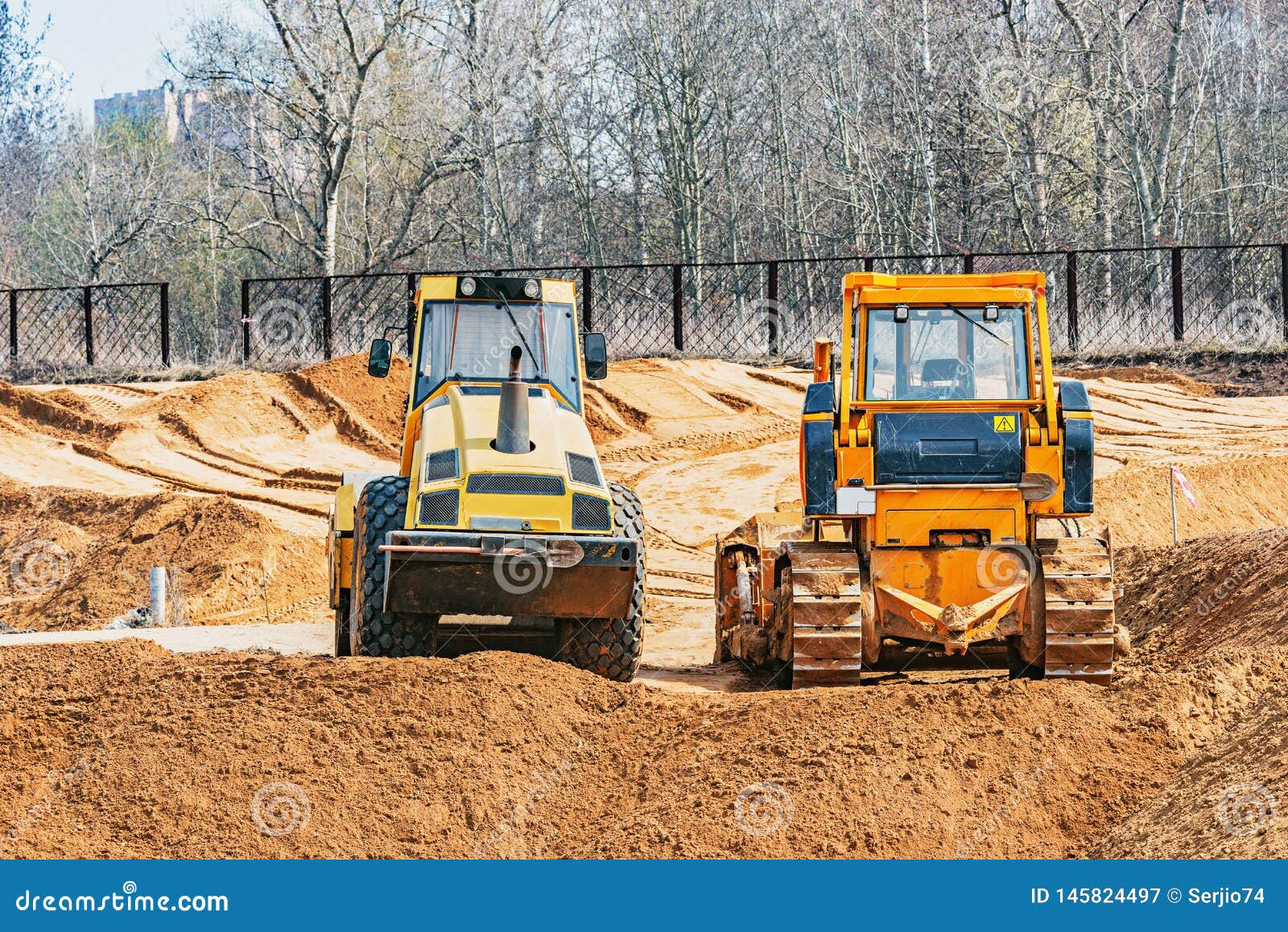 Bulldozer and road roller. stock image. Image of engine - 145824497