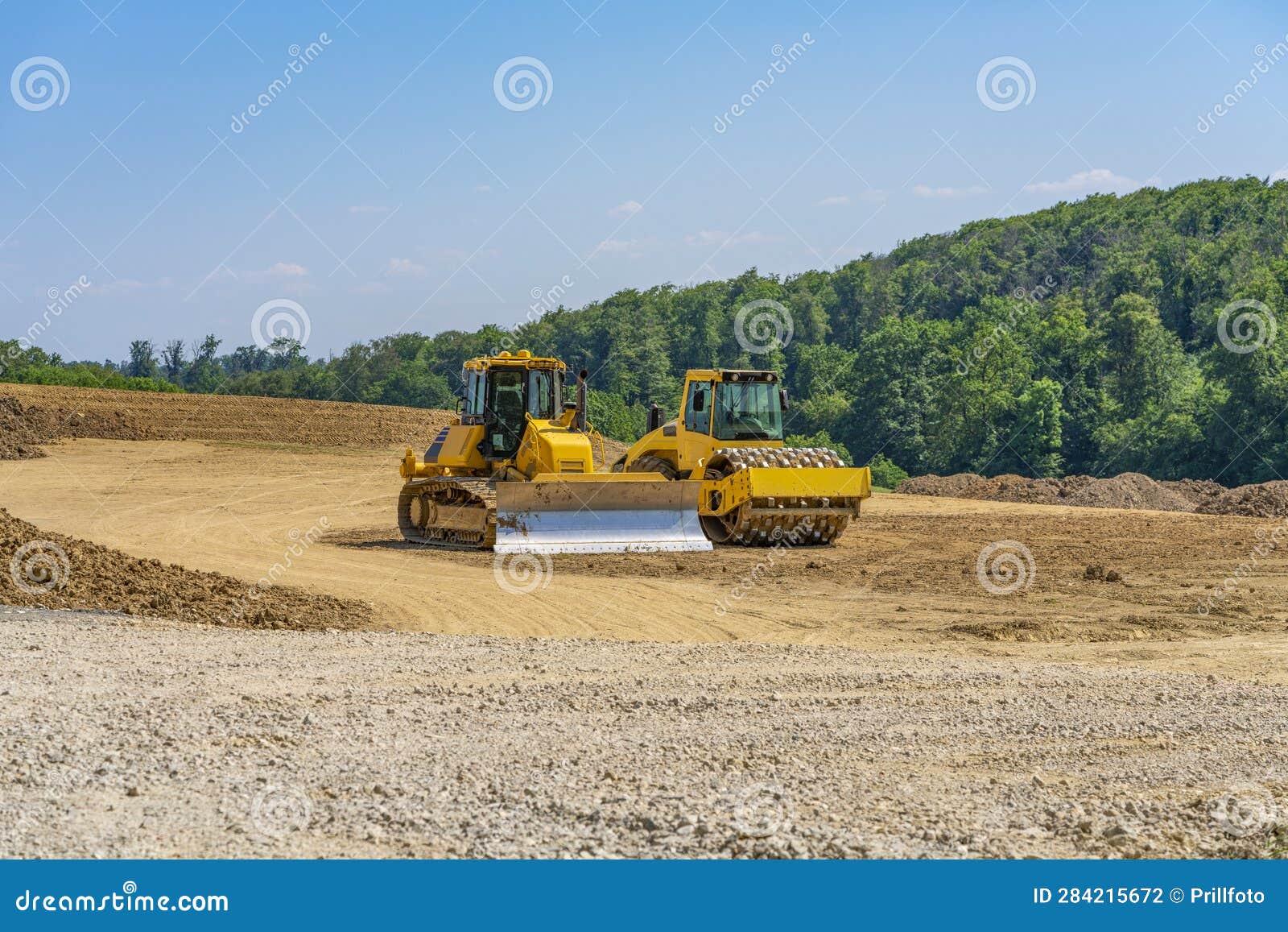 Bulldozer and Roller Compactor Stock Photo - Image of site, compactor ...