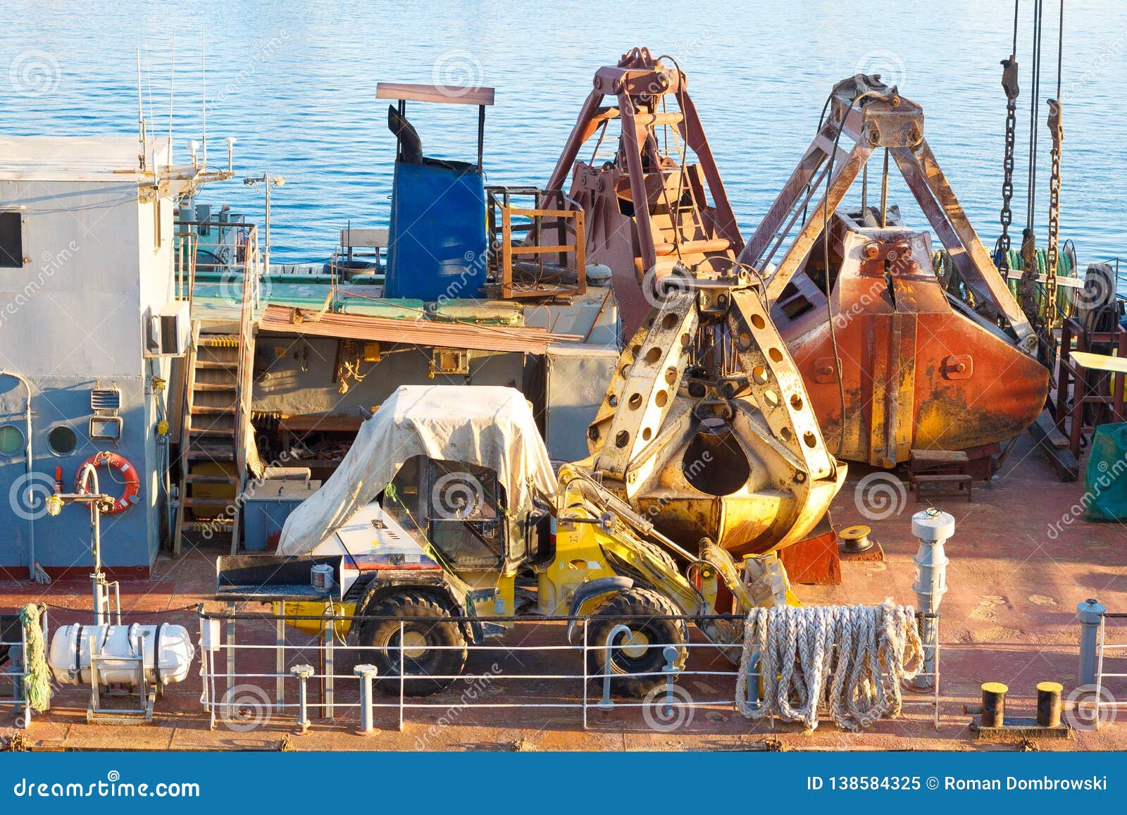 Bulldozer and Rusty Scoop of Cargo Crane on the Ship Deck Stock Image ...
