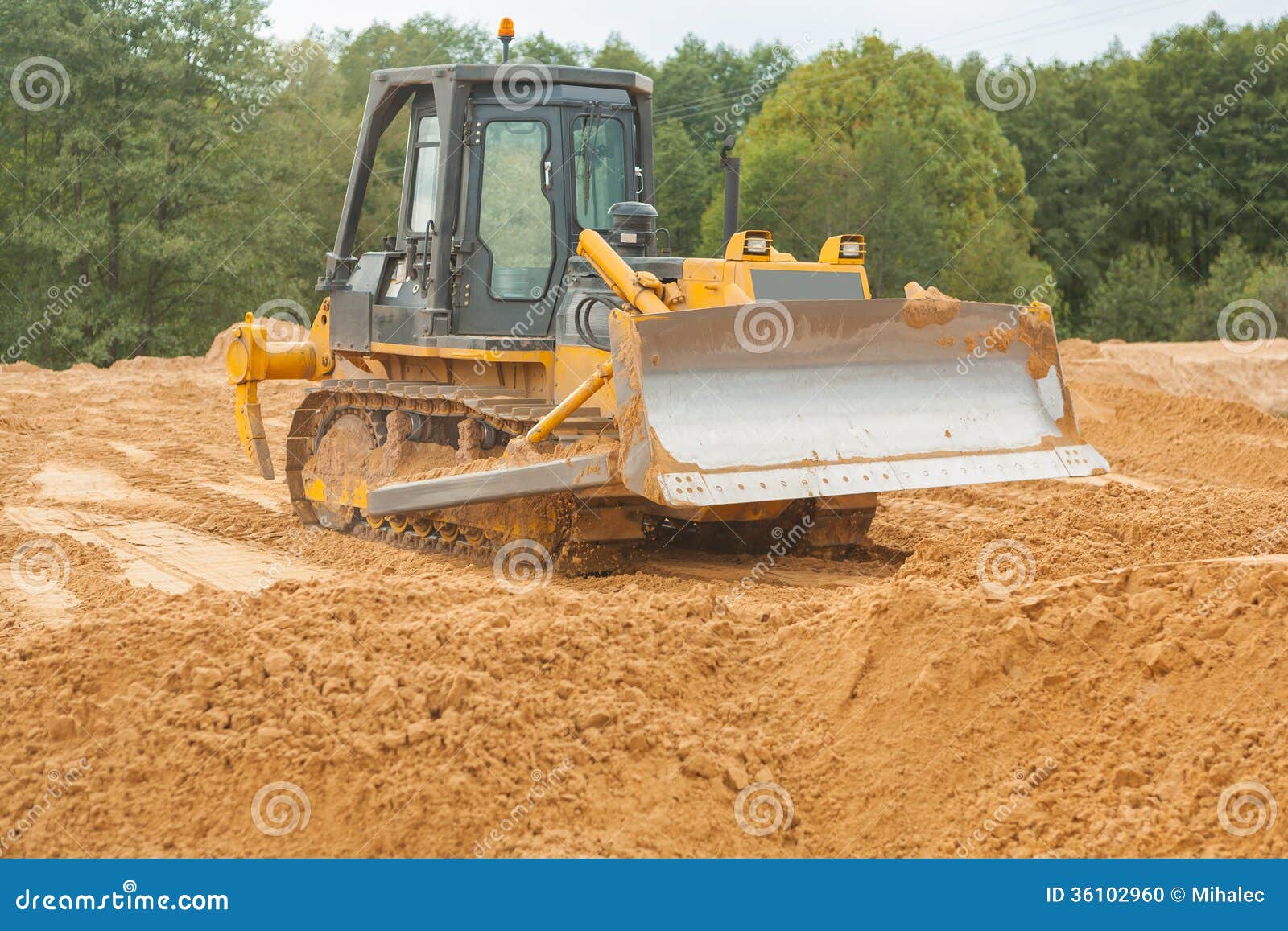 Bulldozer on sand stock photo. Image of motion, land - 36102960