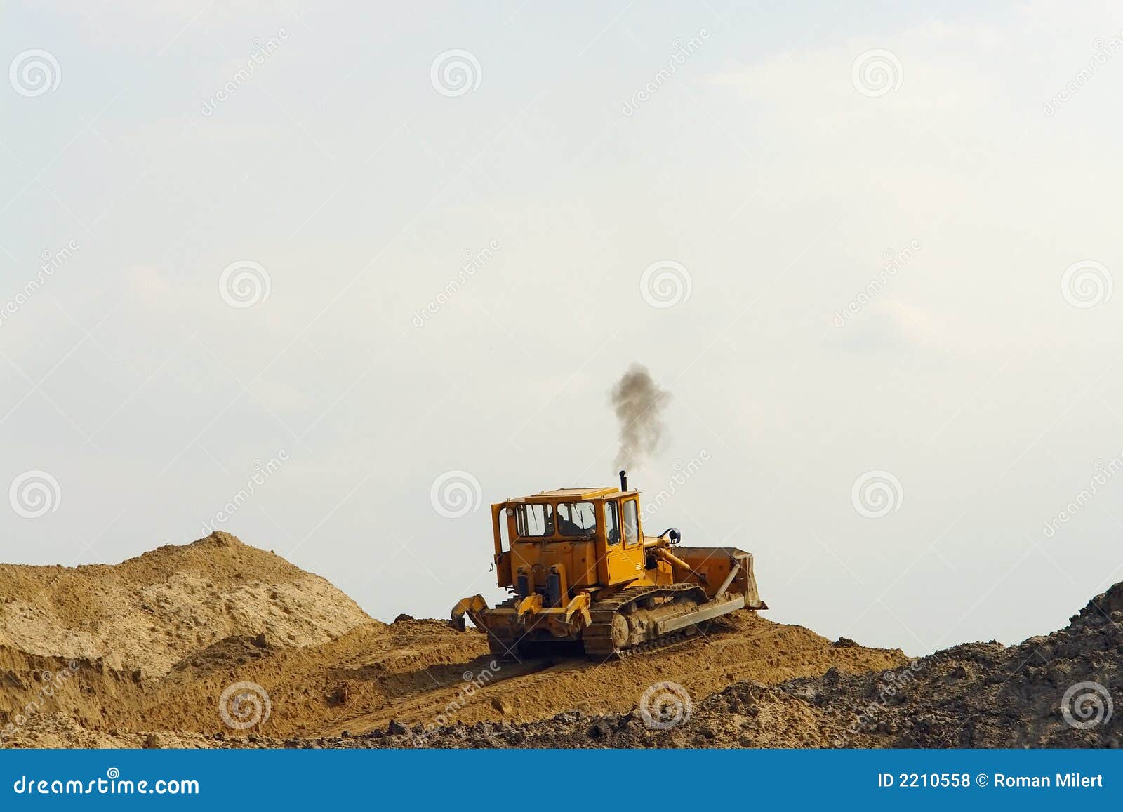 Bulldozer on sand heap stock photo. Image of heap, industry - 2210558