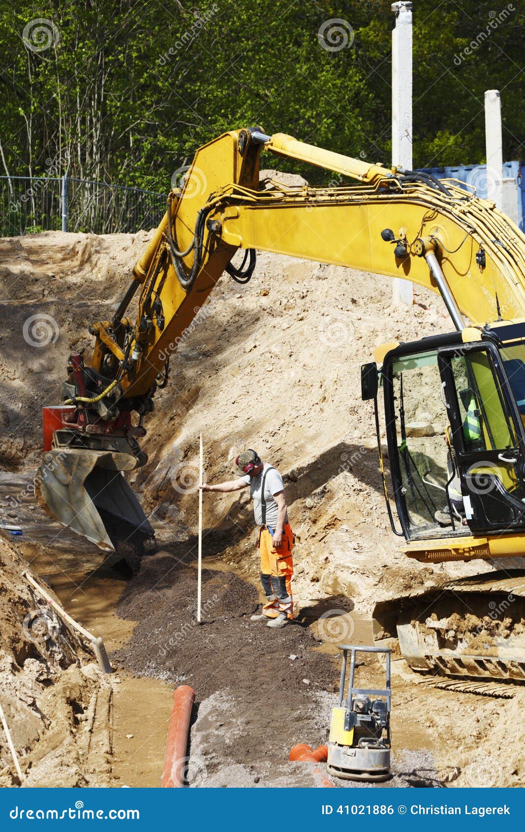 Bulldozer and Site Worker in Action Stock Photo - Image of worker ...