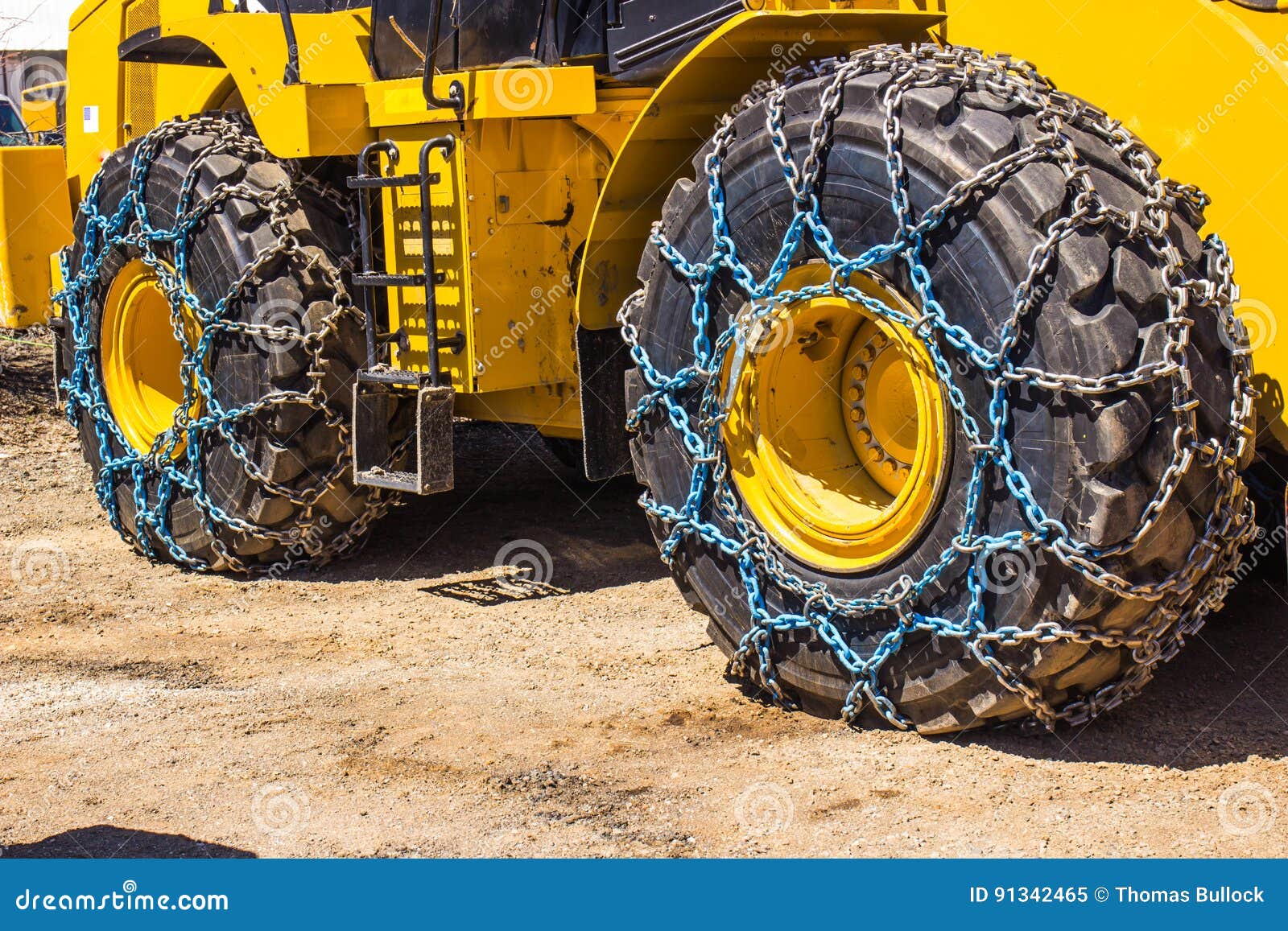 Bulldozer with Tire Chains stock image. Image of construction - 91342465