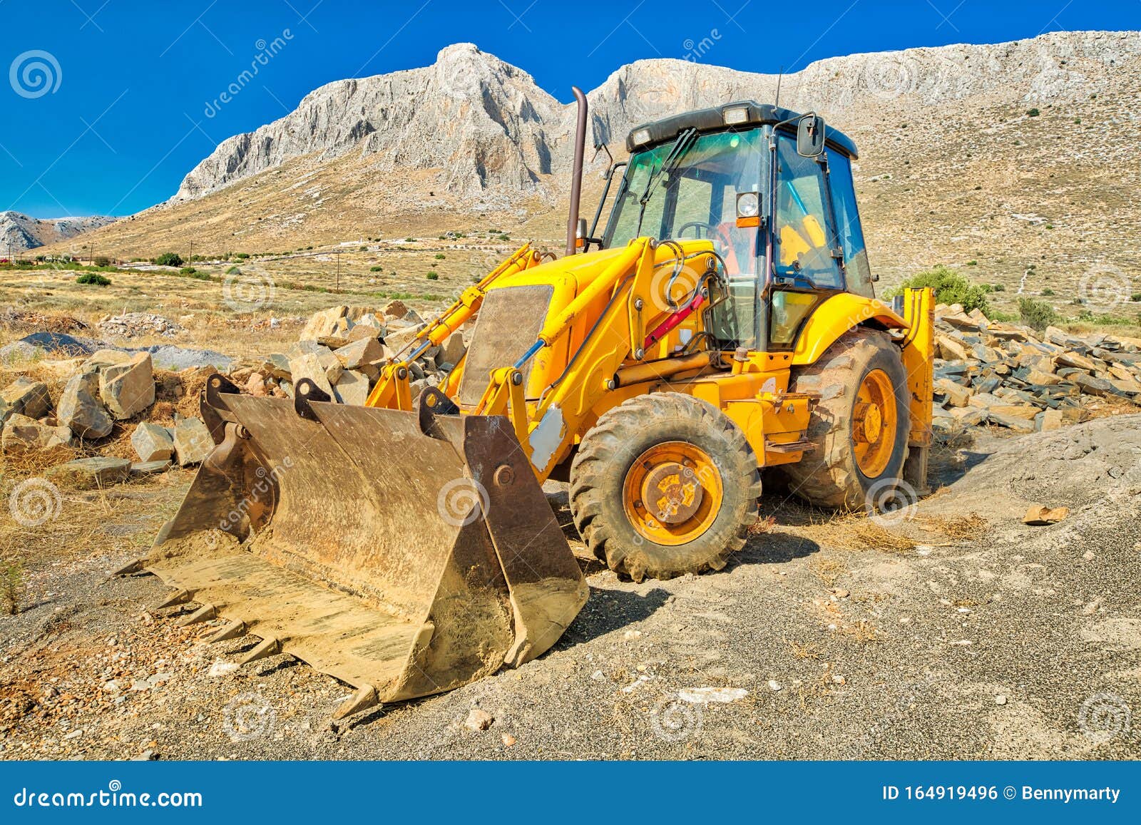 Bulldozer on wheels stock photo. Image of outdoor, excavation - 164919496