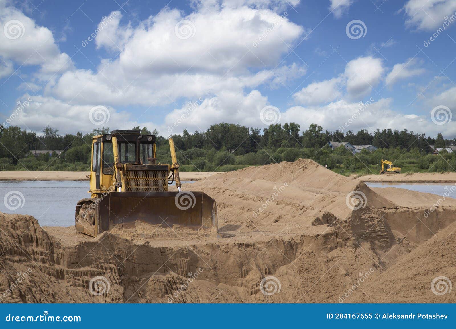 A Bulldozer. a Bulldozer is Working on Loading Sand Stock Image - Image ...