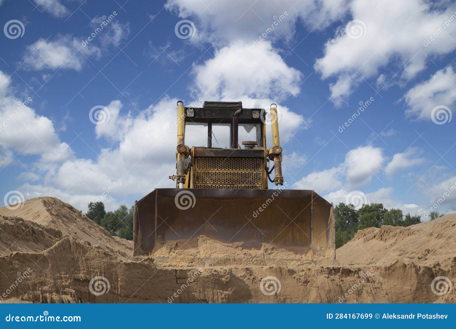 A Bulldozer. a Bulldozer is Working on Loading Sand Stock Image - Image ...