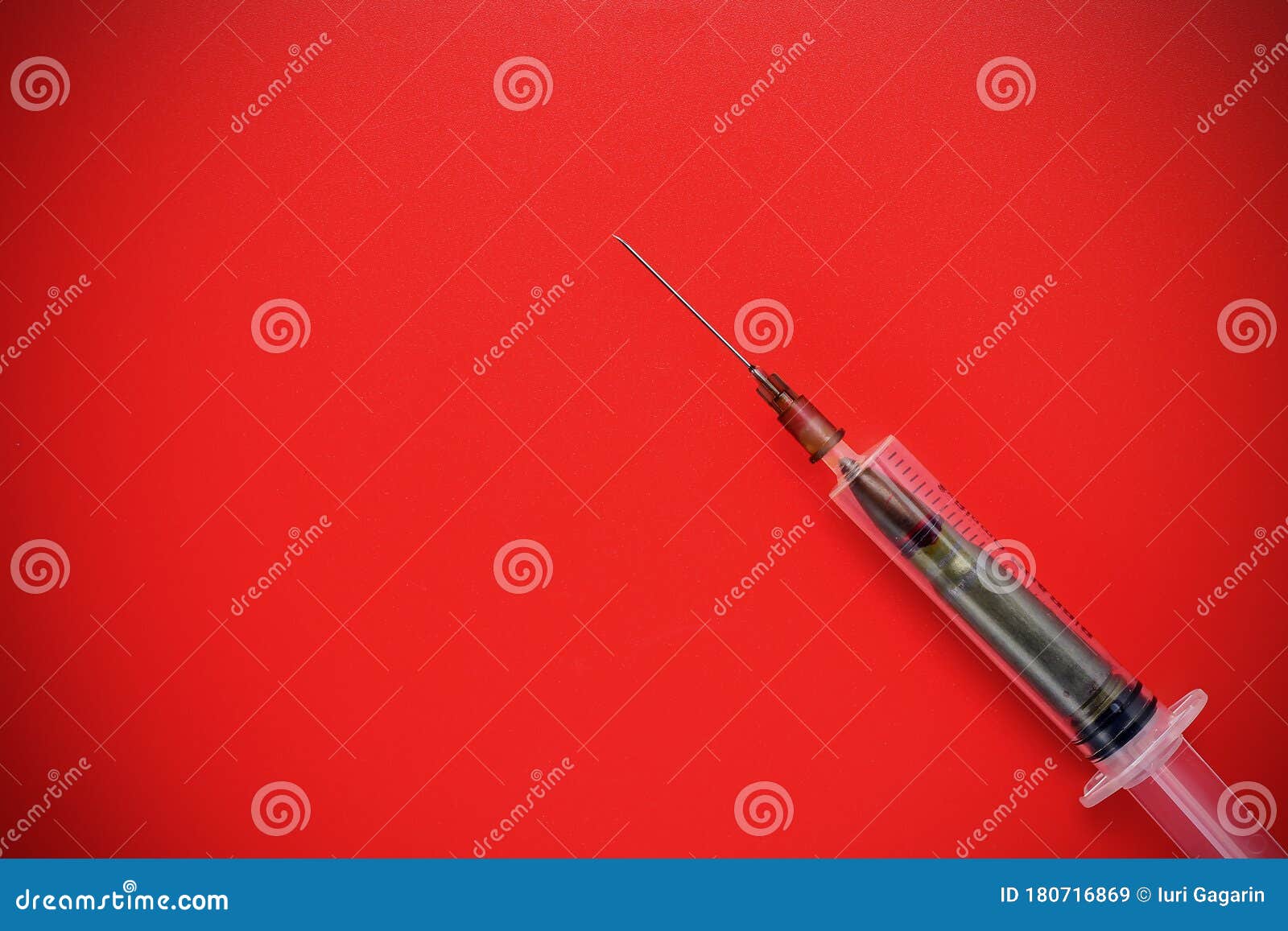 Bullet in a Disposable Syringe on a Red Background Stock Image - Image ...