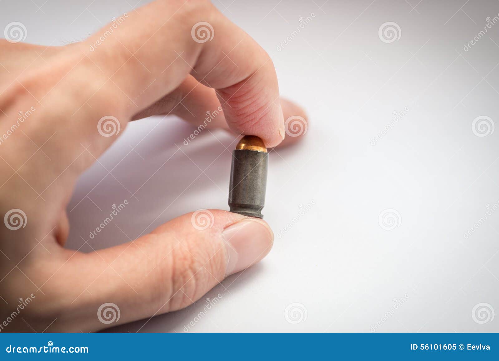 Bullet in fingers. stock image. Image of caliber, ammunition - 56101605
