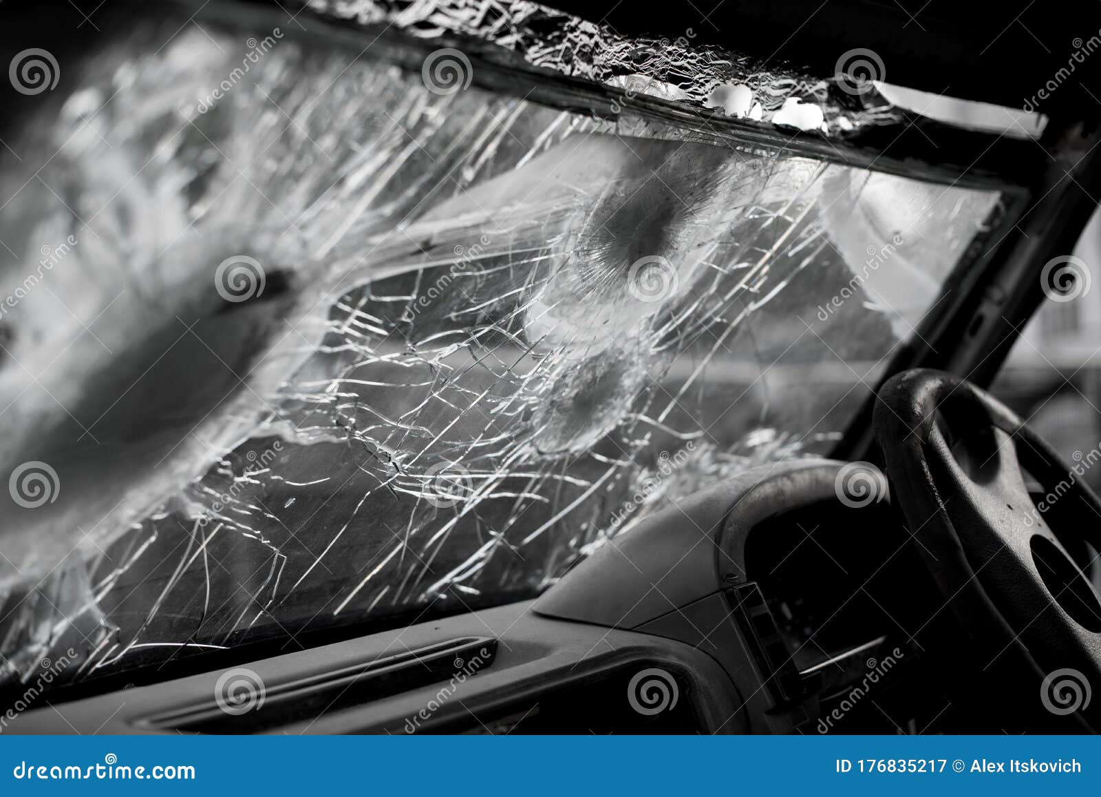 Bullet Hole on a Car Windshield. Car Window after a Raid Has a Bullet ...
