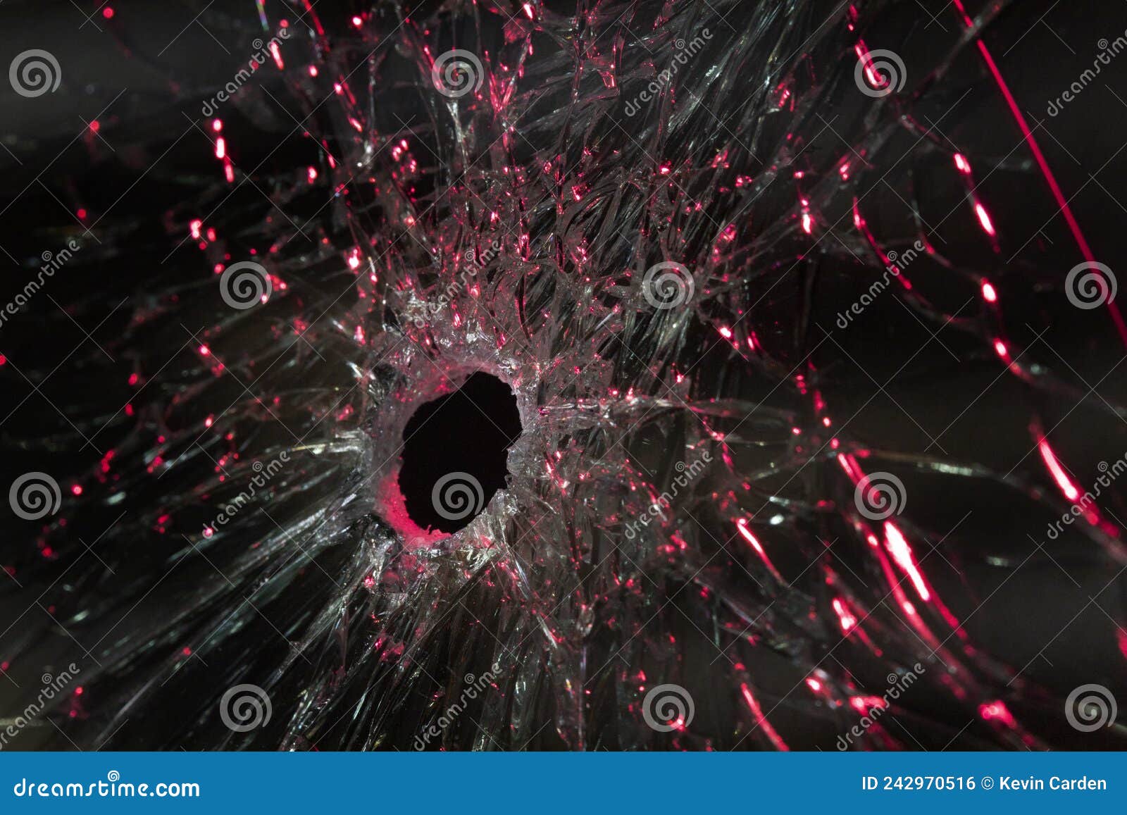 Bullet Hole through Red Windshield Stock Photo - Image of window ...