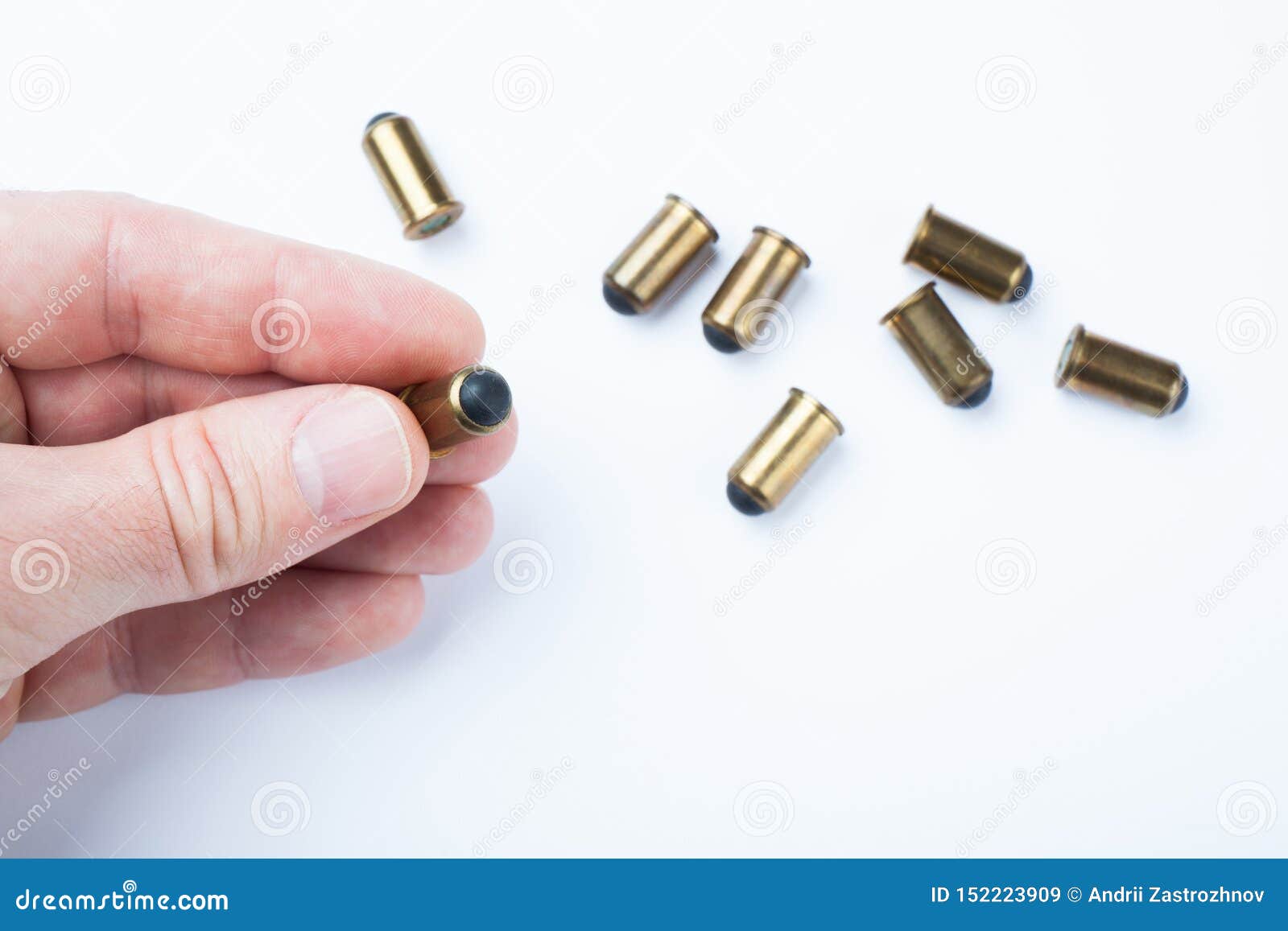 A Bullet in a Man`s Hand is a Component of a Firearm and is a Shell ...
