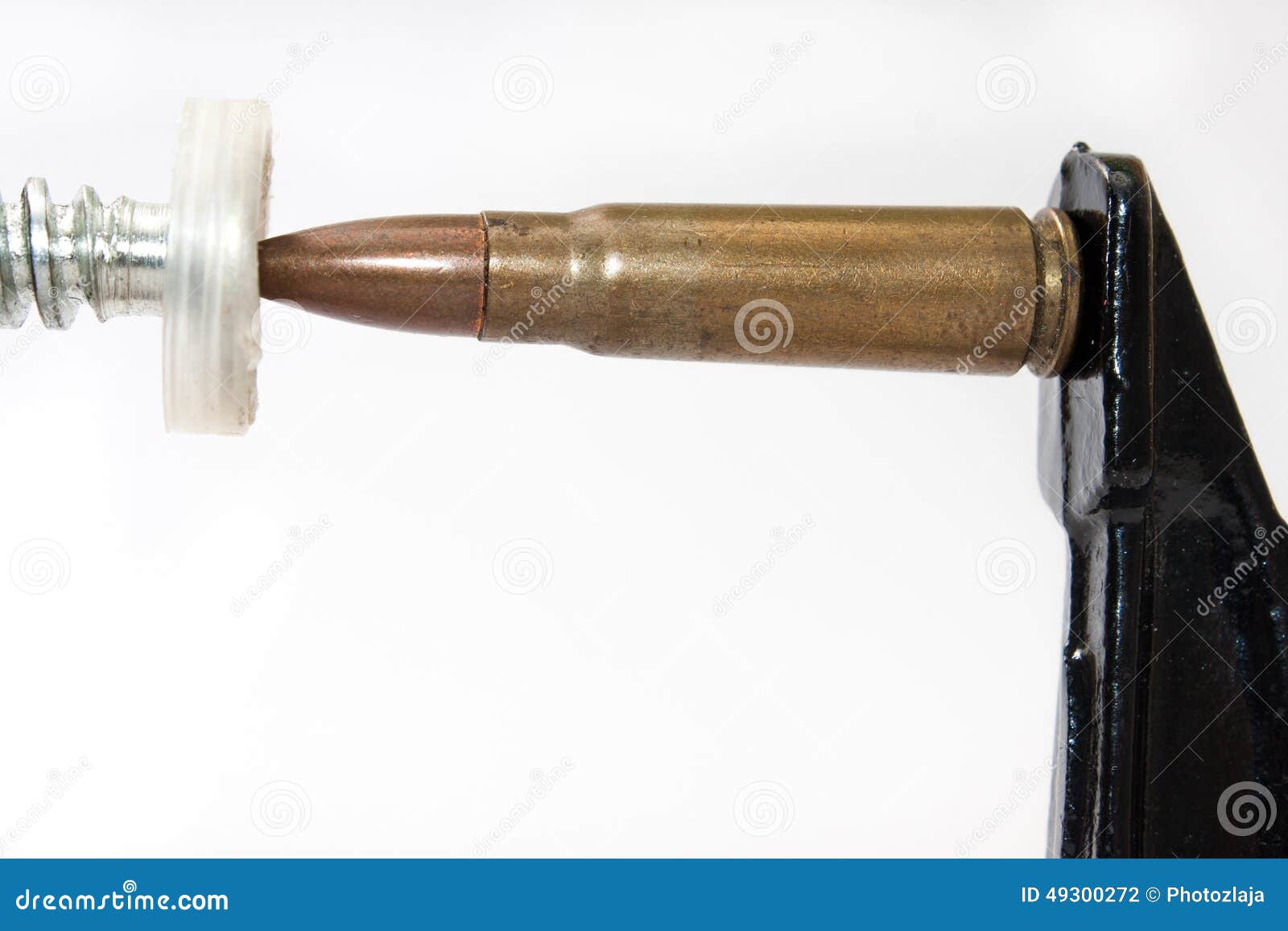Bullet in the metal clamps stock photo. Image of isolated - 49300272