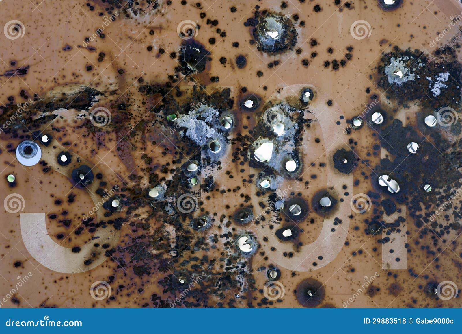 Bullet riddled stop sign stock photo. Image of rusty - 29883518