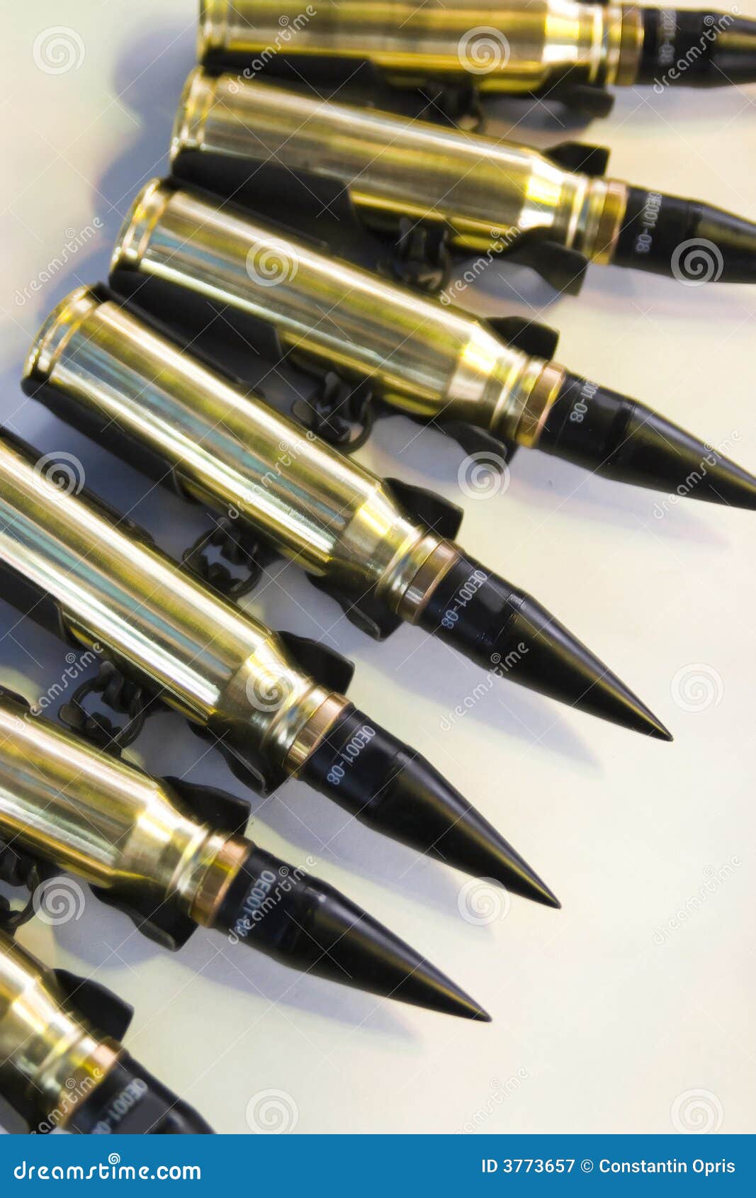 Bullets in ammunition belt stock image. Image of macro - 3773657