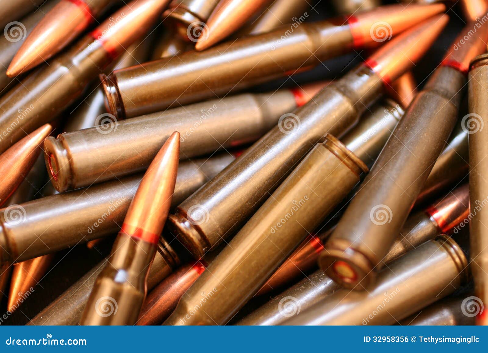 Pile Of Bullets With Copper Tips Under A Warm Light. Close Up Of A Lot ...