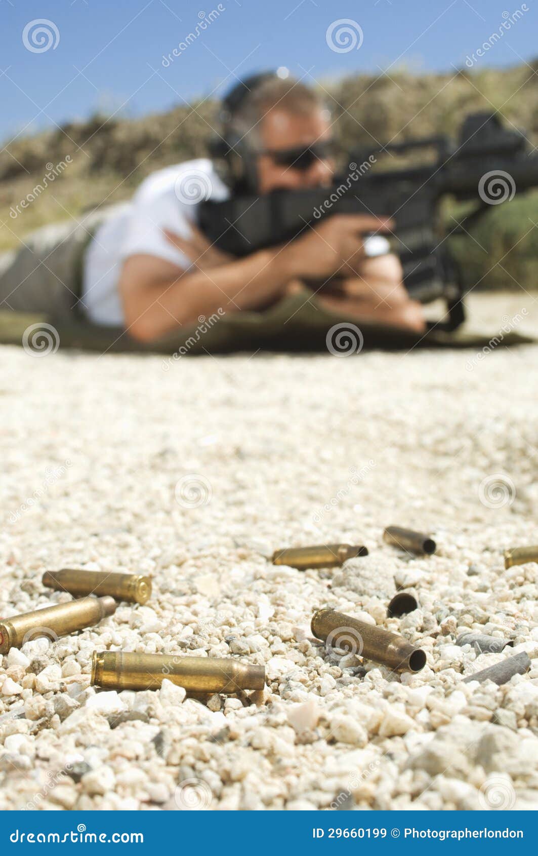 Bullets on Ground with Man Aiming Machine Gun Stock Image - Image of ...