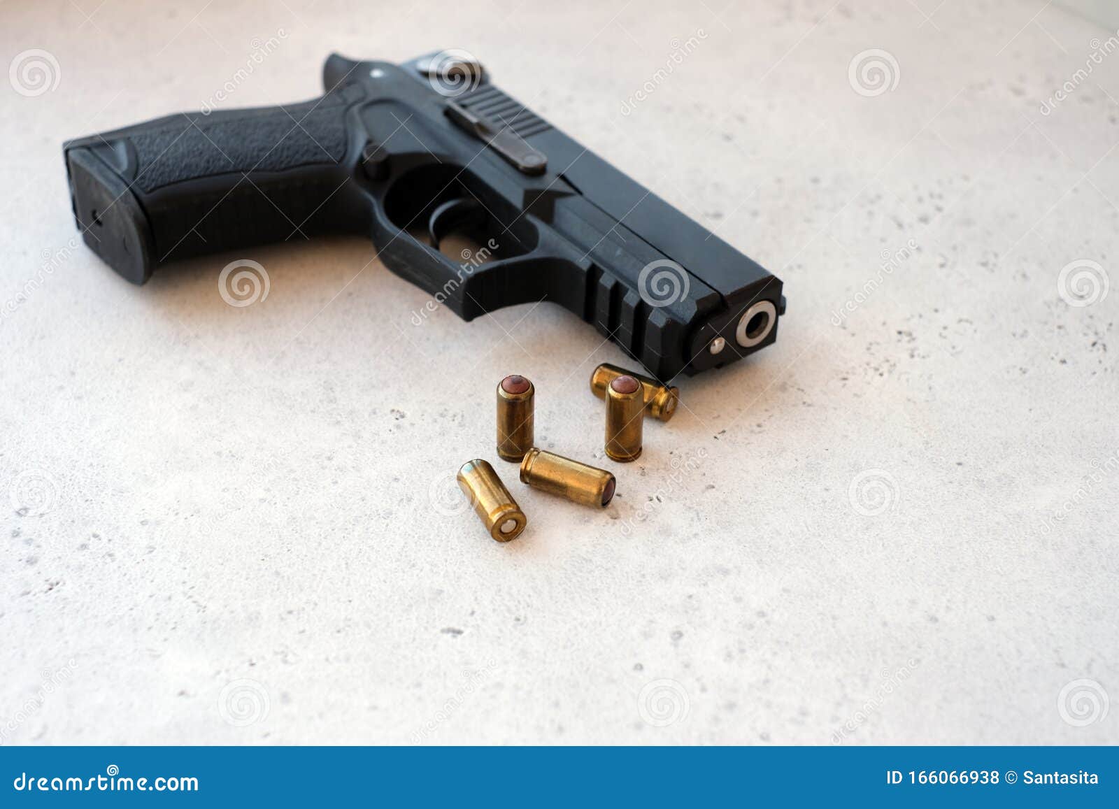 Bullets with Handgun in the Back of the Scene with Focus on the Bullet ...