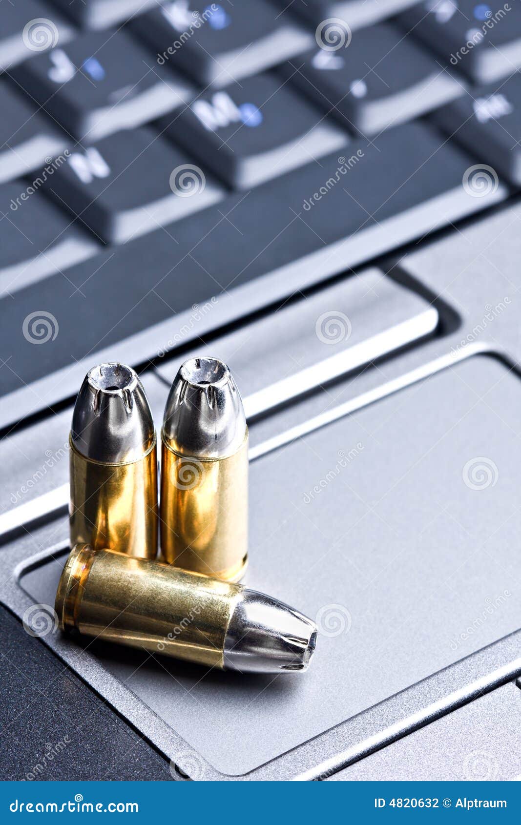 Bullets on laptop stock photo. Image of keyboard, lethal - 4820632