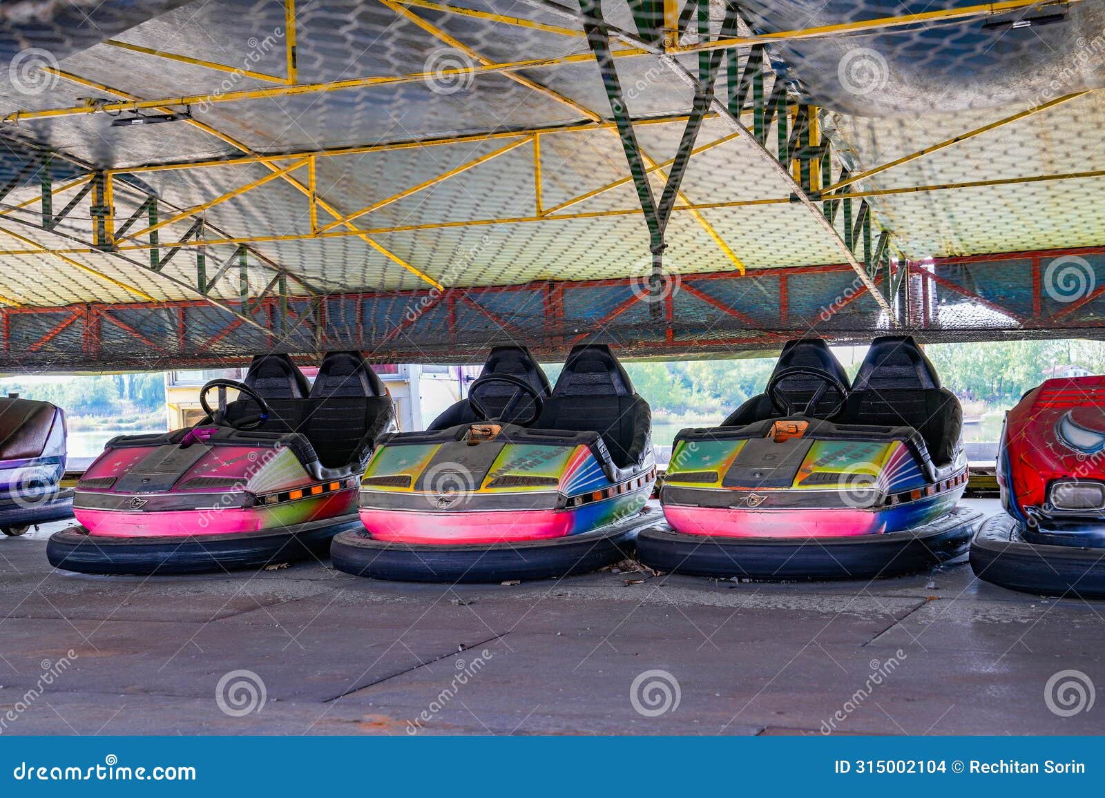 ARAD, ROMANIA, 12 APRIL, 2024: Colorful Bumper Cars in Amusement Park ...