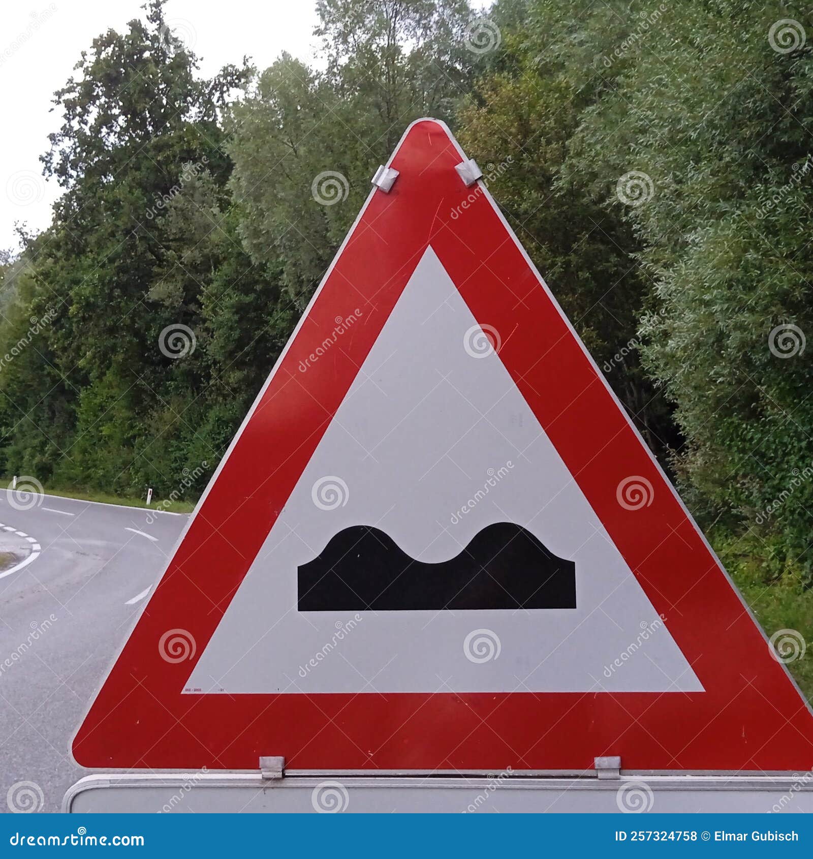 Bumps and Ground Waves Ahead Traffic Sign Stock Photo - Image of ...