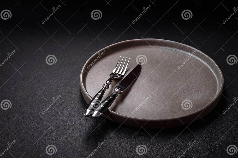 Bumpy Empty Ceramic Plate on a Textured Concrete Background Stock Image ...